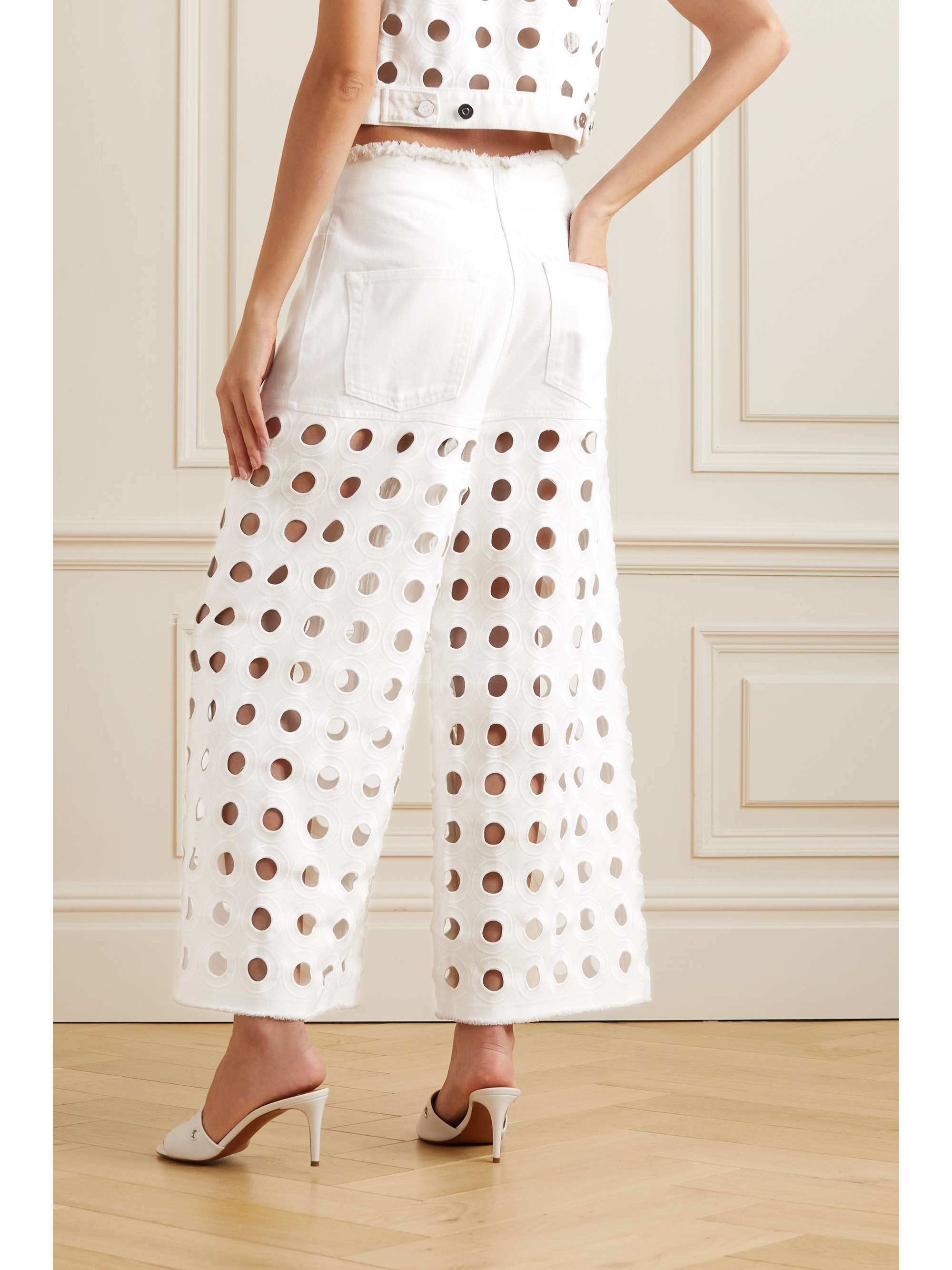 ALAÏA Embroidered laser-cut frayed low-rise jeans | NET-A-PORTER