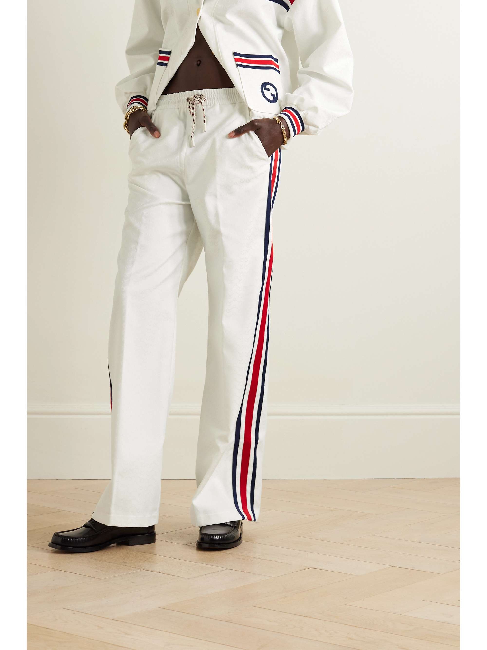 GUCCI Appliquéd webbing-trimmed jersey-jacquard track pants | NET-A-PORTER