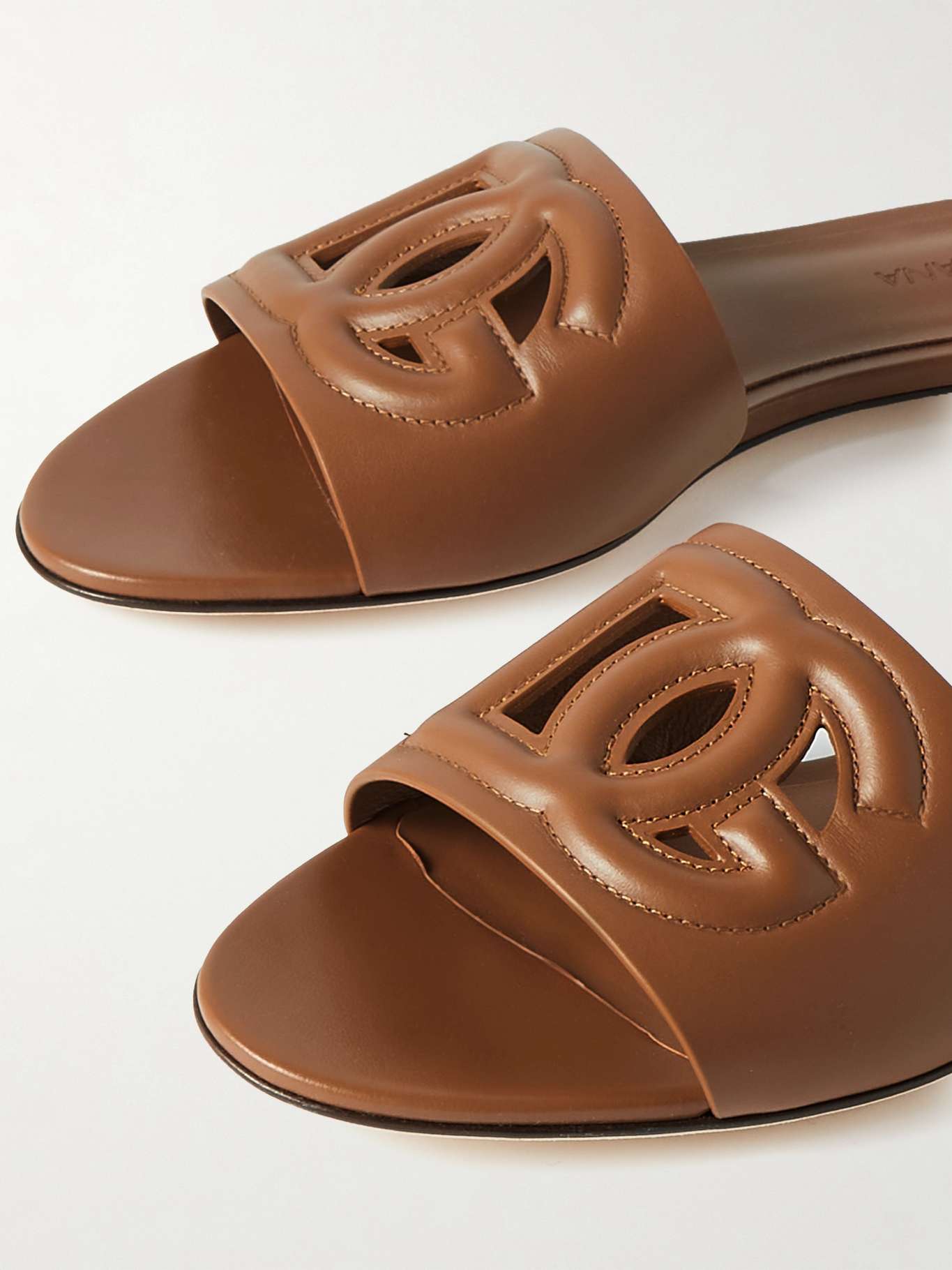 DOLCE&GABBANA Bianca cutout leather slides | NET-A-PORTER