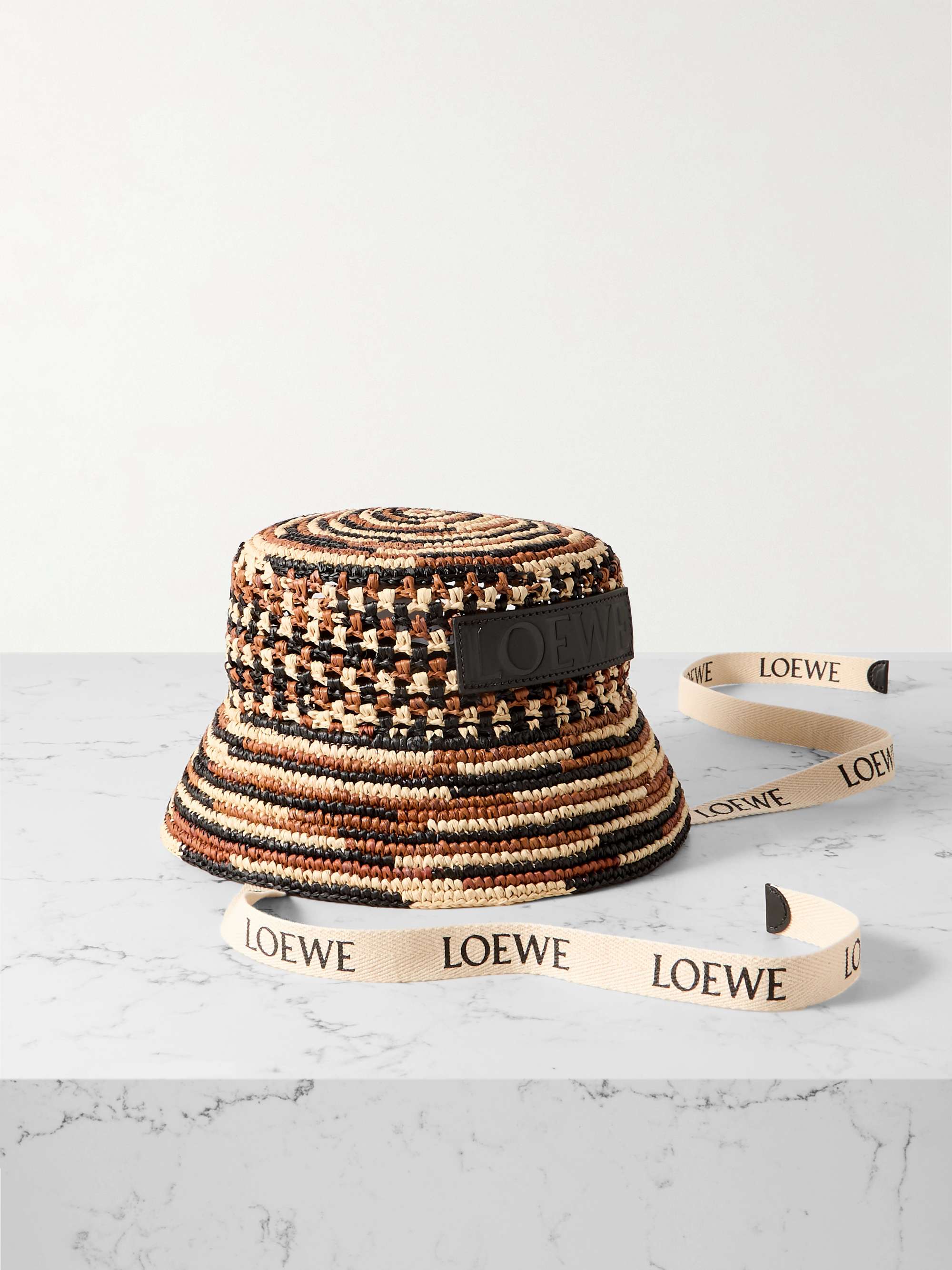 LOEWE + Paula's Ibiza leather and webbing-trimmed striped raffia bucket ...
