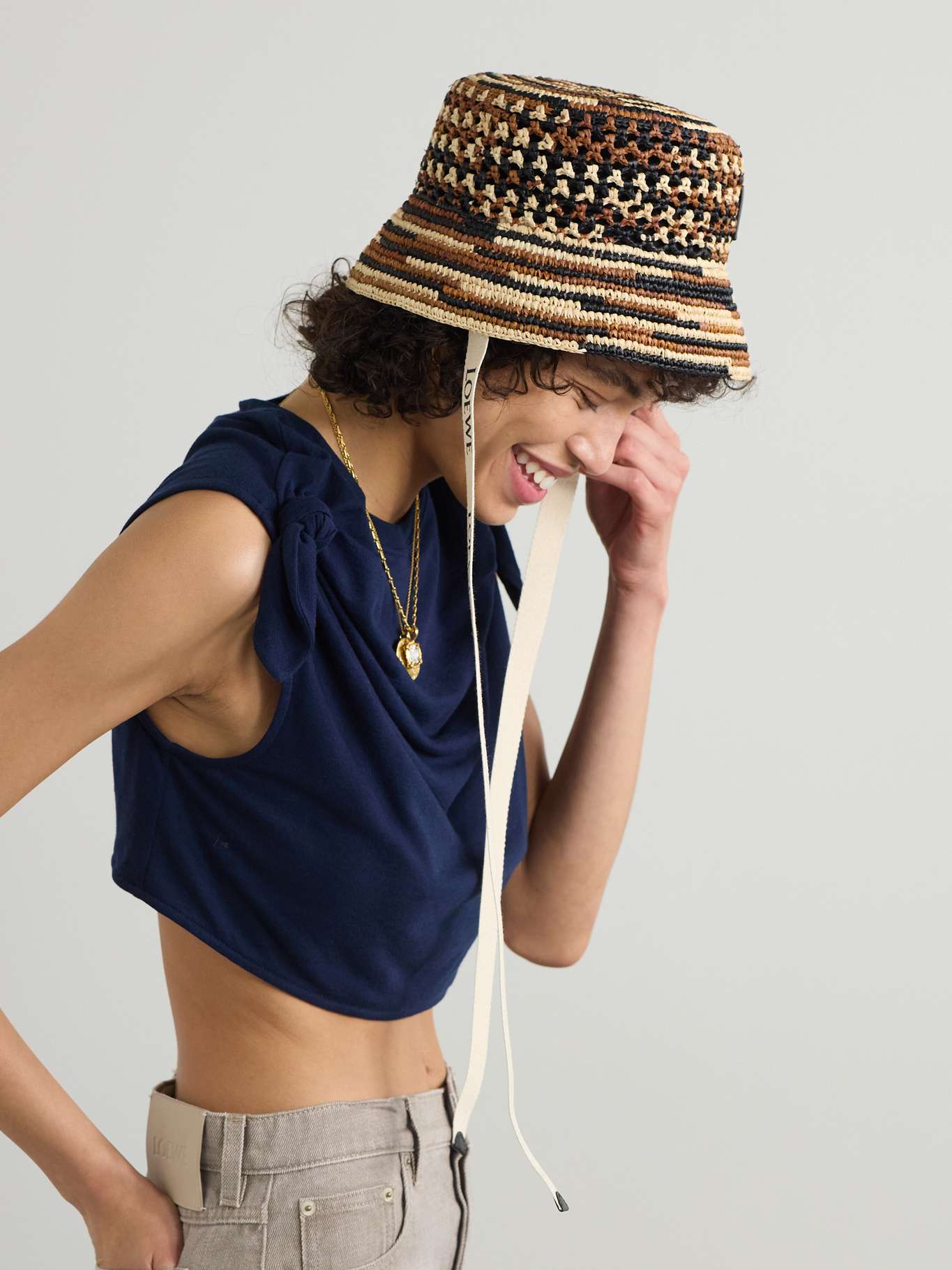 LOEWE + Paula's Ibiza leather and webbing-trimmed striped raffia bucket ...