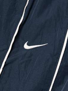 NIKE Striped shell track pants | NET-A-PORTER