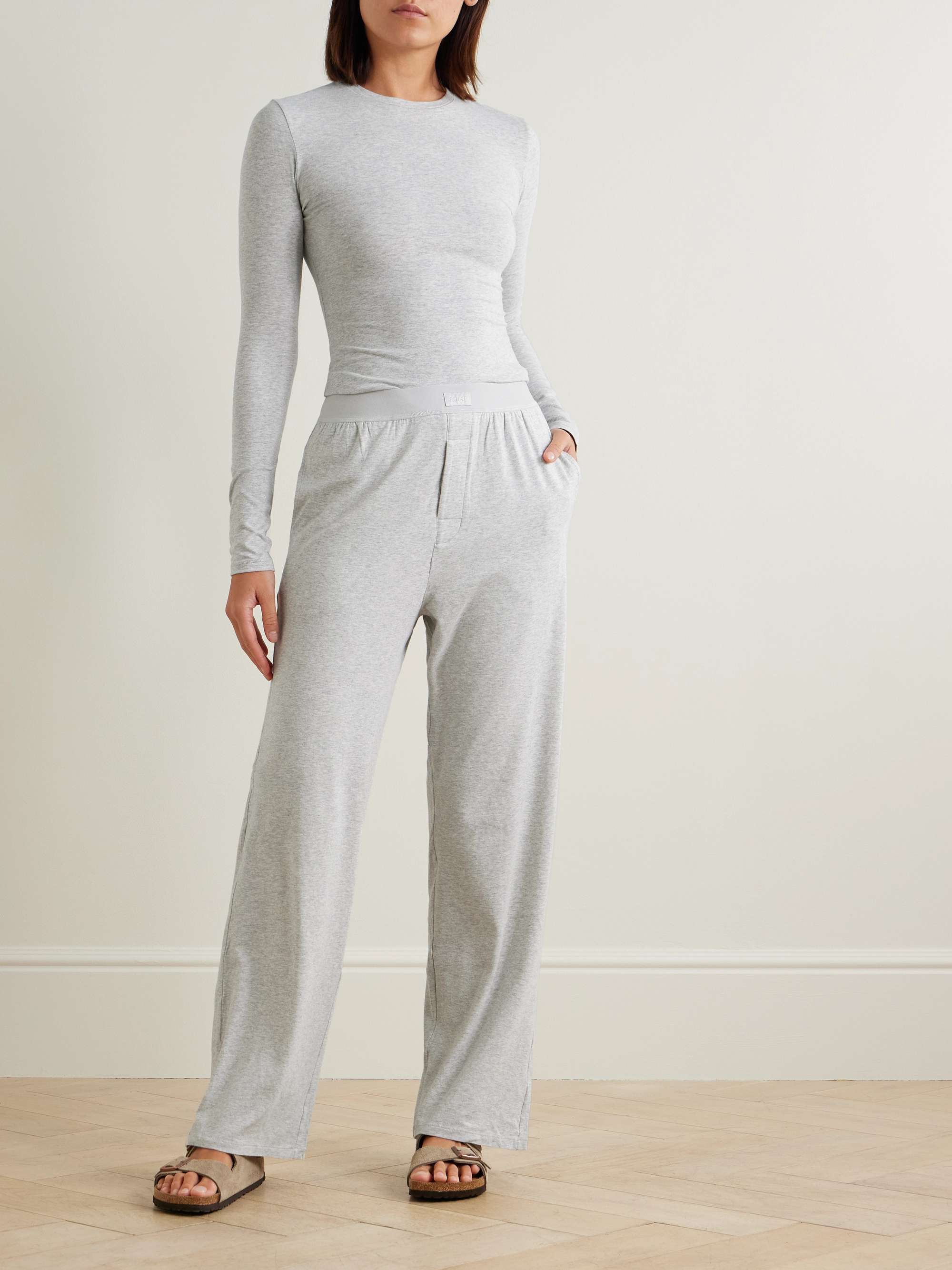 SKIMS Boyfriend stretch-modal and cotton-blend jersey track pants ...