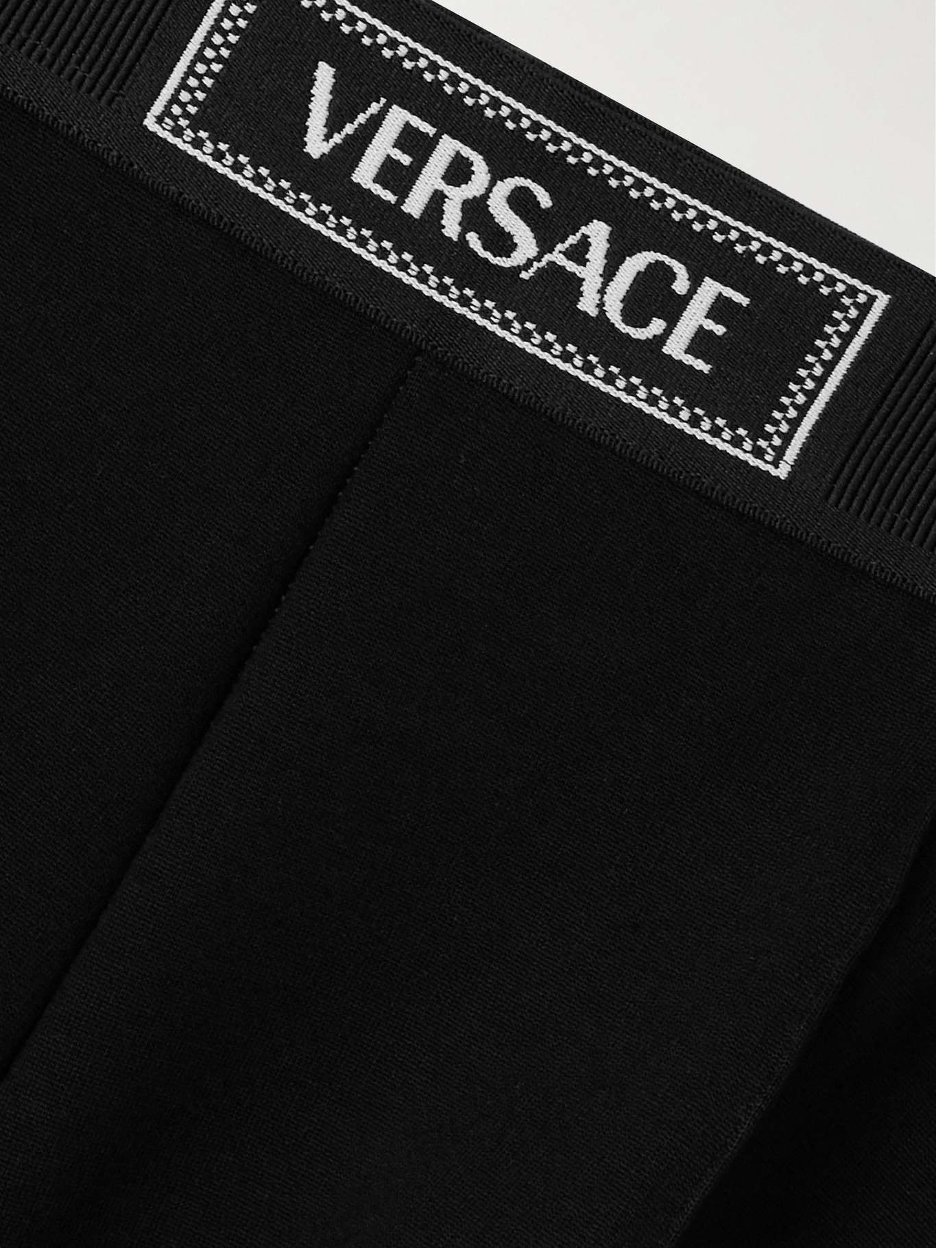 VERSACE Stretch-jersey stirrup leggings | NET-A-PORTER
