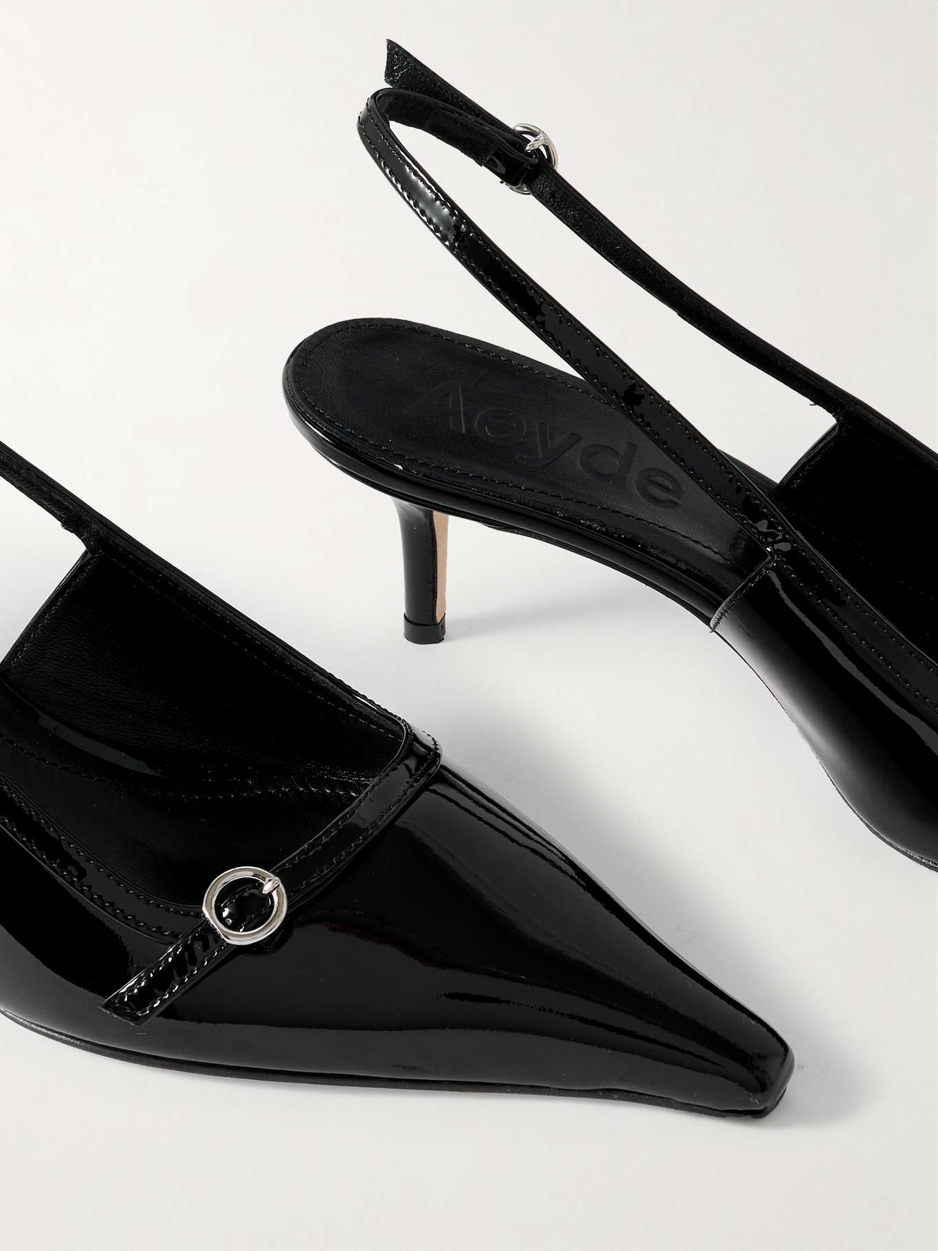 Black Saba buckled patent-leather slingback pumps | AEYDE | NET-A-PORTER