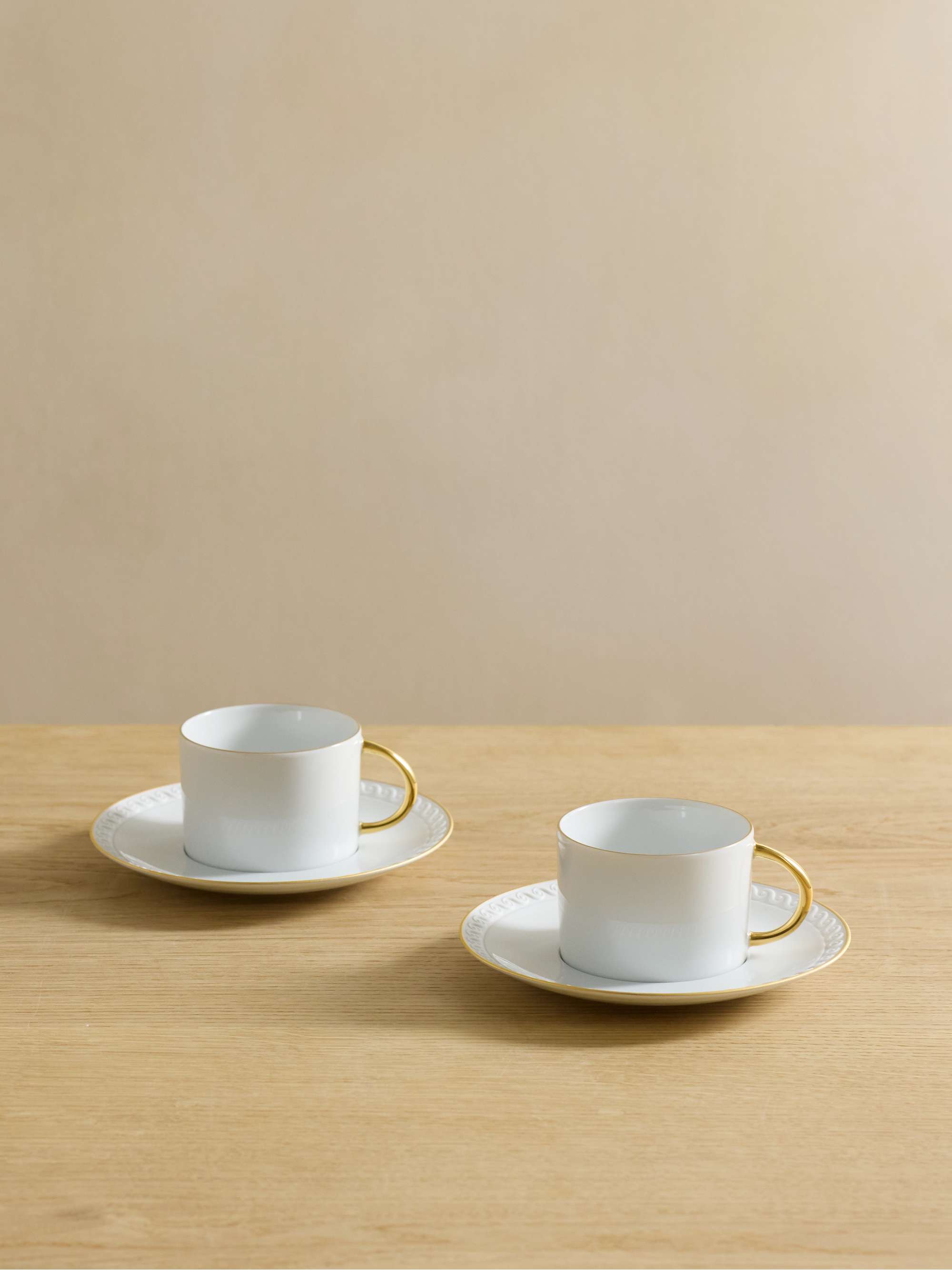 L'OBJET Neptune set of two gold-plated porcelain tea cups and saucers ...