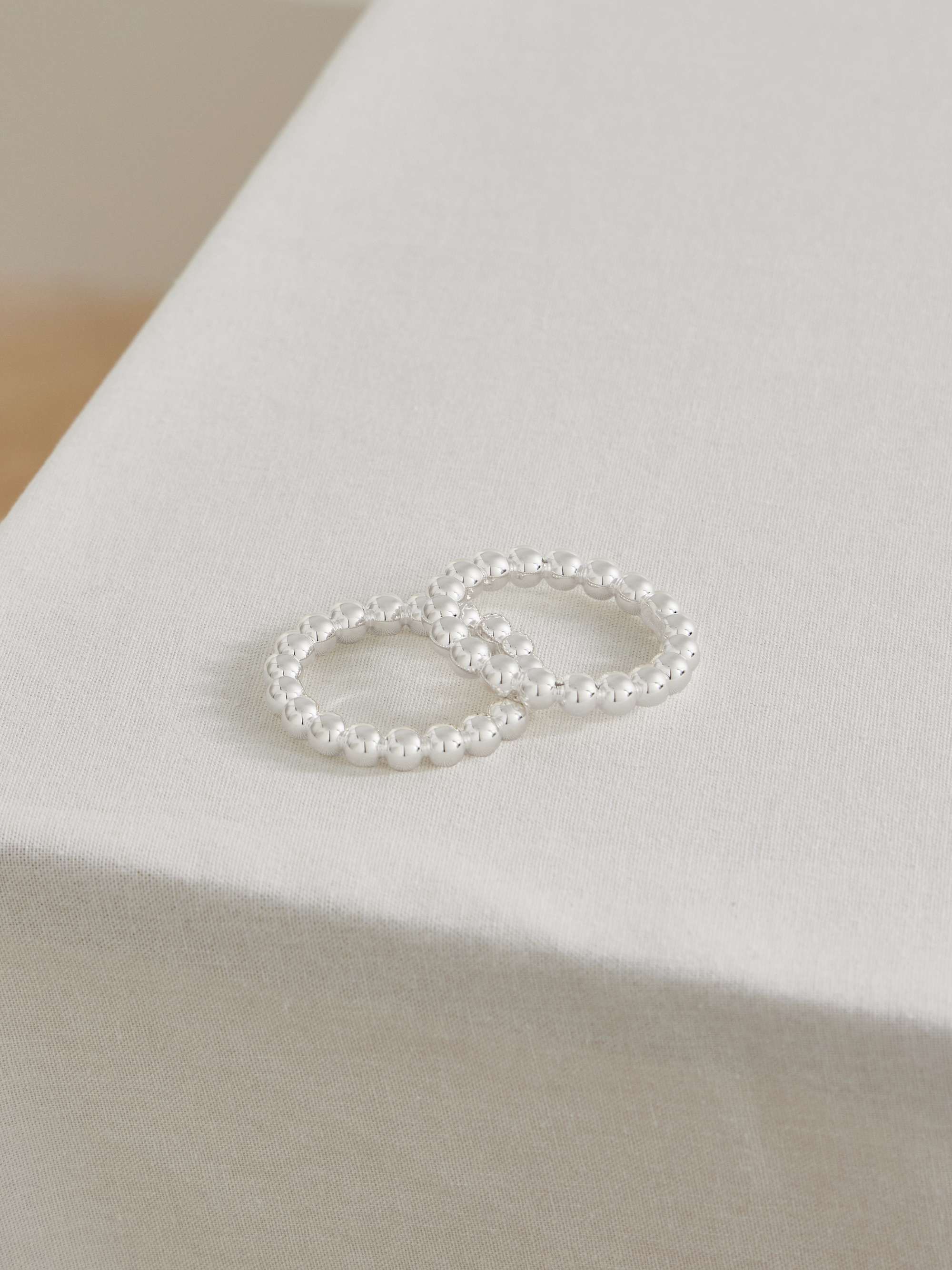 CHRISTOFLE Perles set of two silver-plated napkin rings | NET-A-PORTER